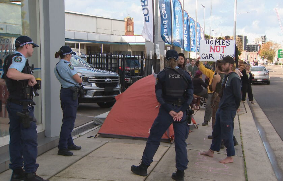 Woman arrested after squatters protest development – NBN News